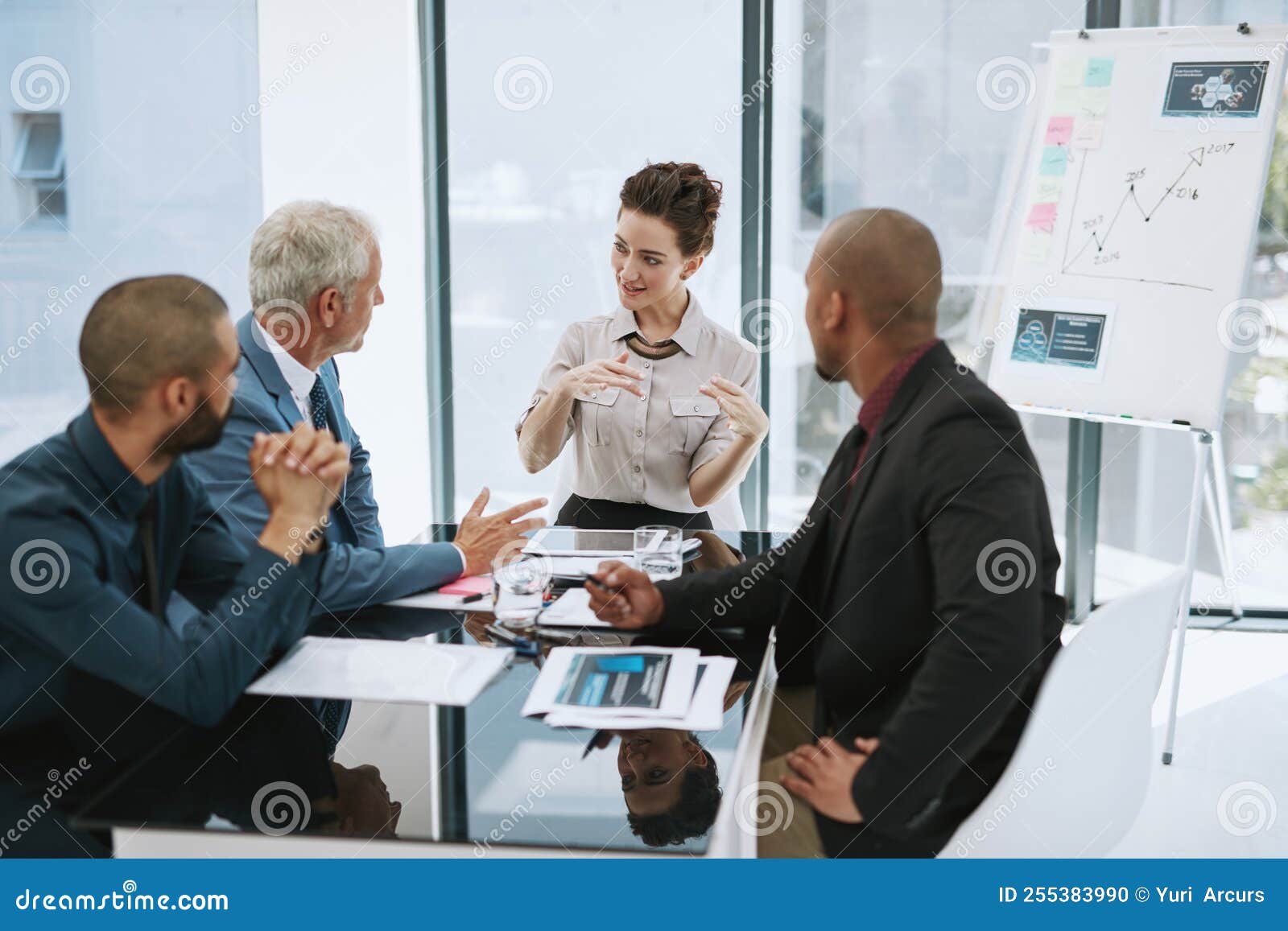 Explaining Everything in Detail. a Group of Businesspeople in the ...