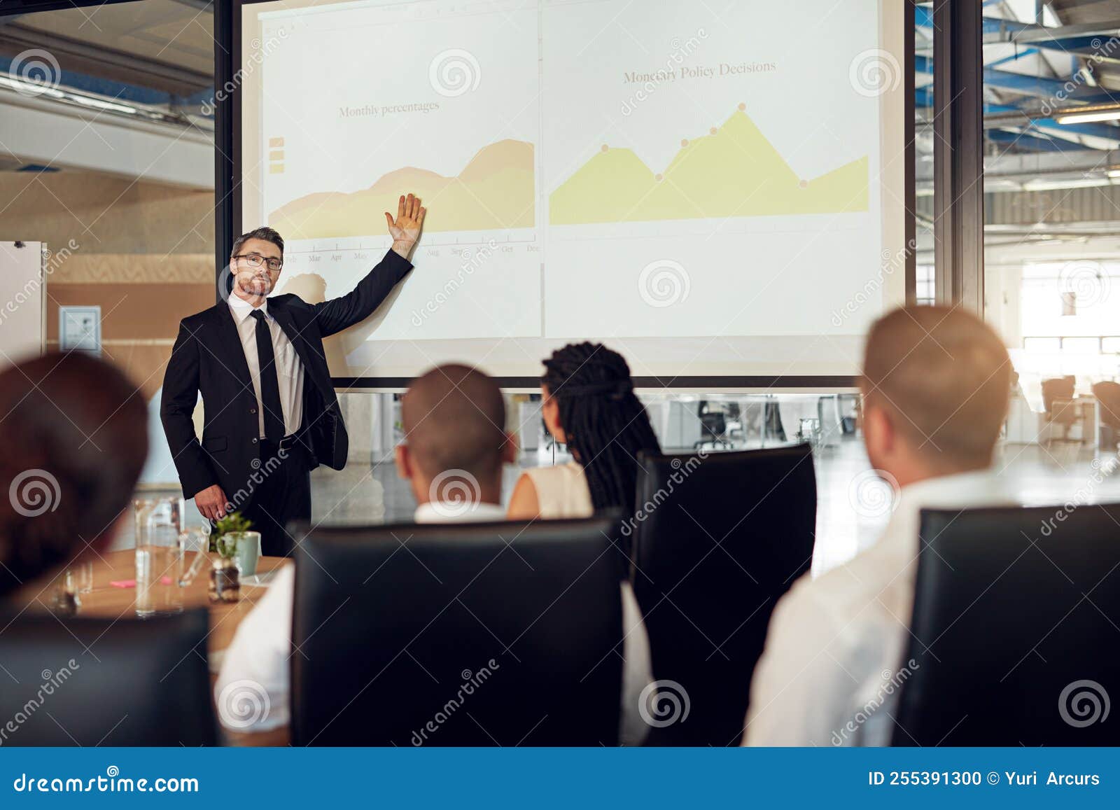 Explaining the Figures Clearly and Concisely. an Executive Giving a ...