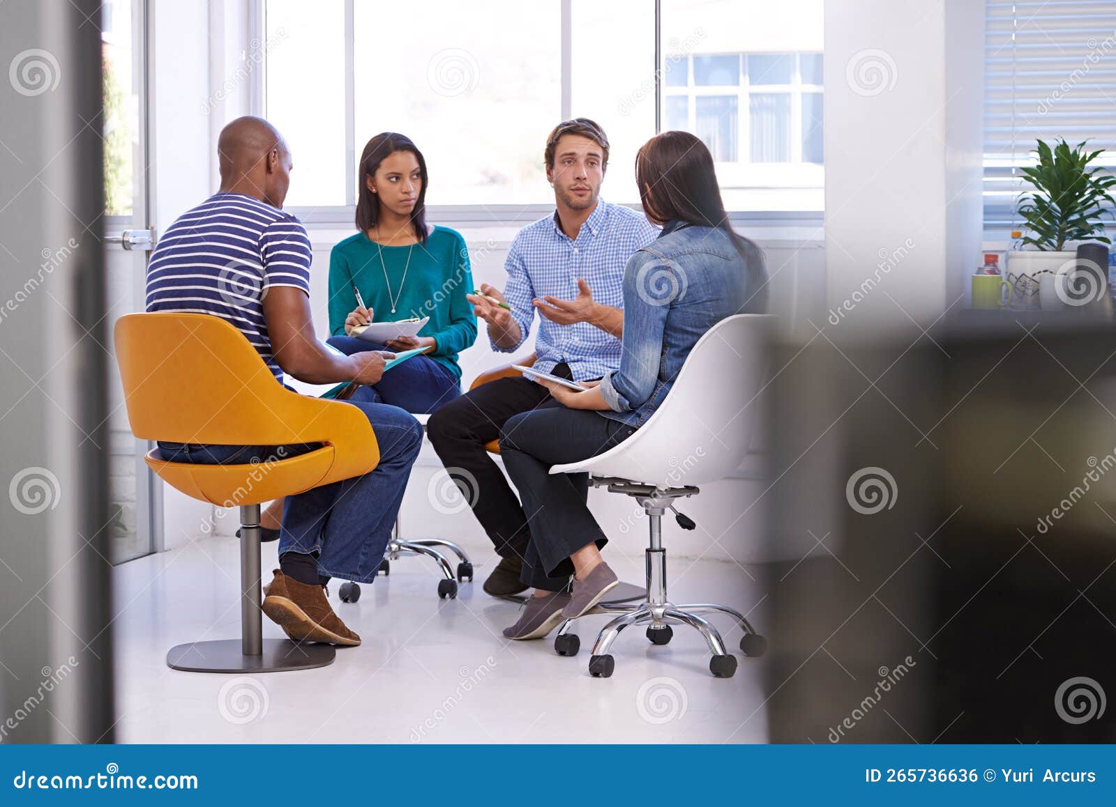 Explaining His Idea. a Young Group of Designers Having a Discussion ...