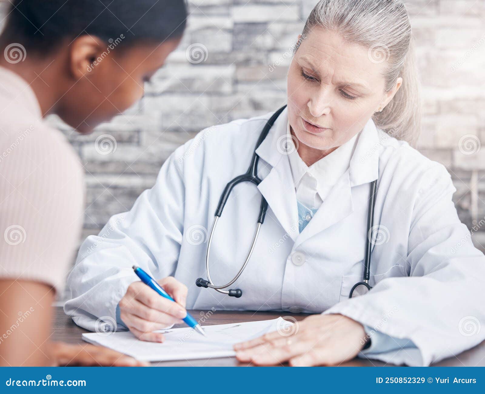 Explaining the Procedure and Treatment Needed. Shot of a Doctor Going ...