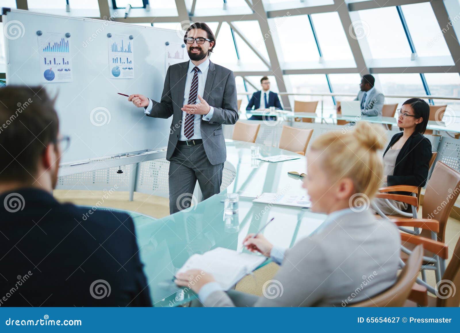 Explaining project stock image. Image of multiethnic - 65654627