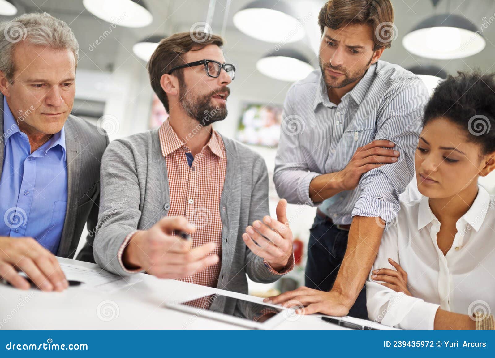 Explaining the Team S Progress. Shot of a Group of Young Professionals ...