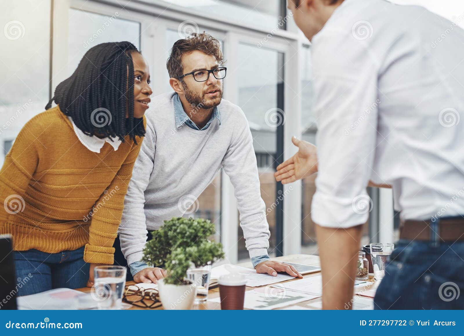 Explaining Their Roles. a Group of Businesspeople Having a ...