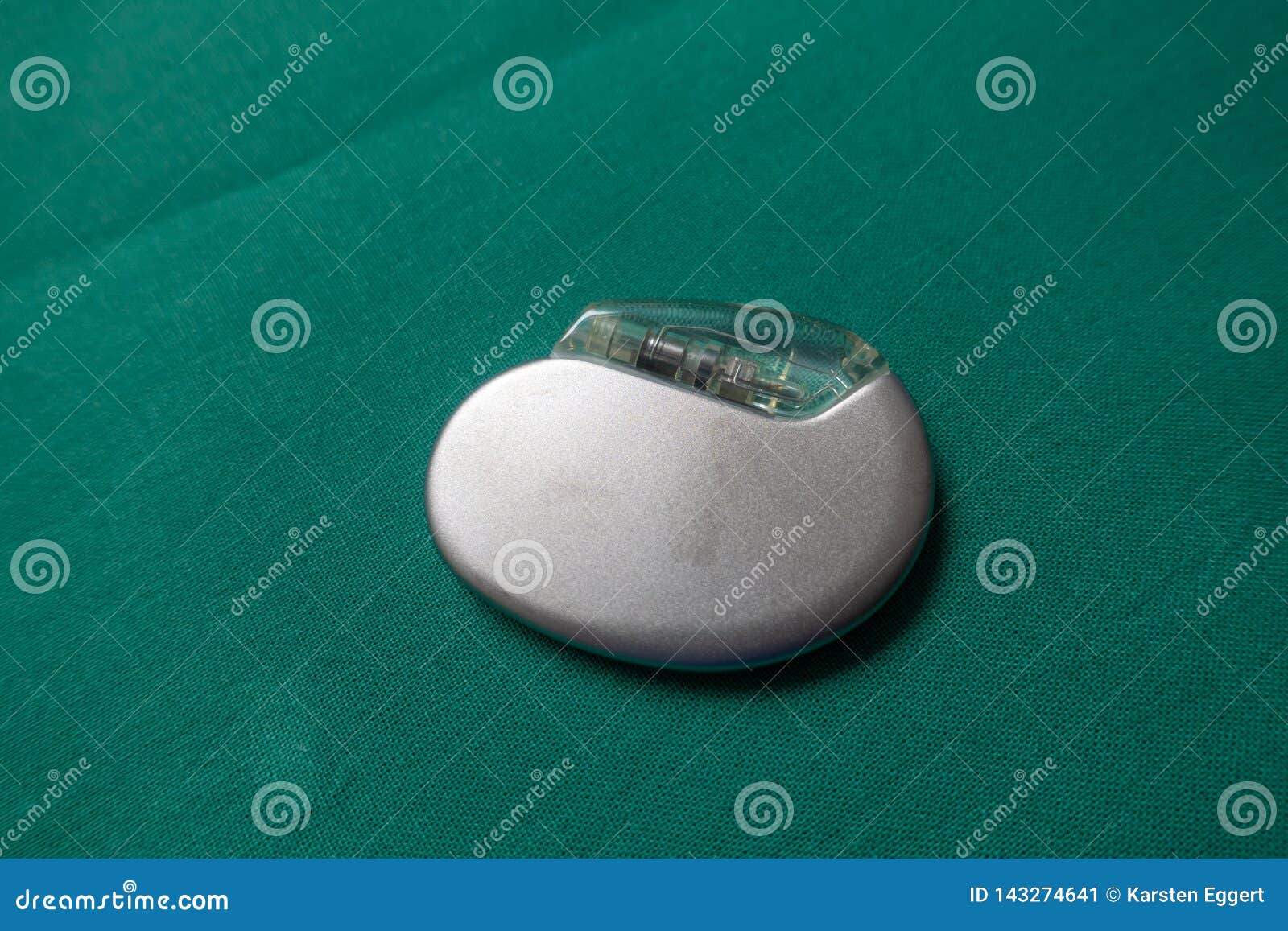 Explanted Pacemaker on a Green Surgical Drape Stock Image - Image of ...