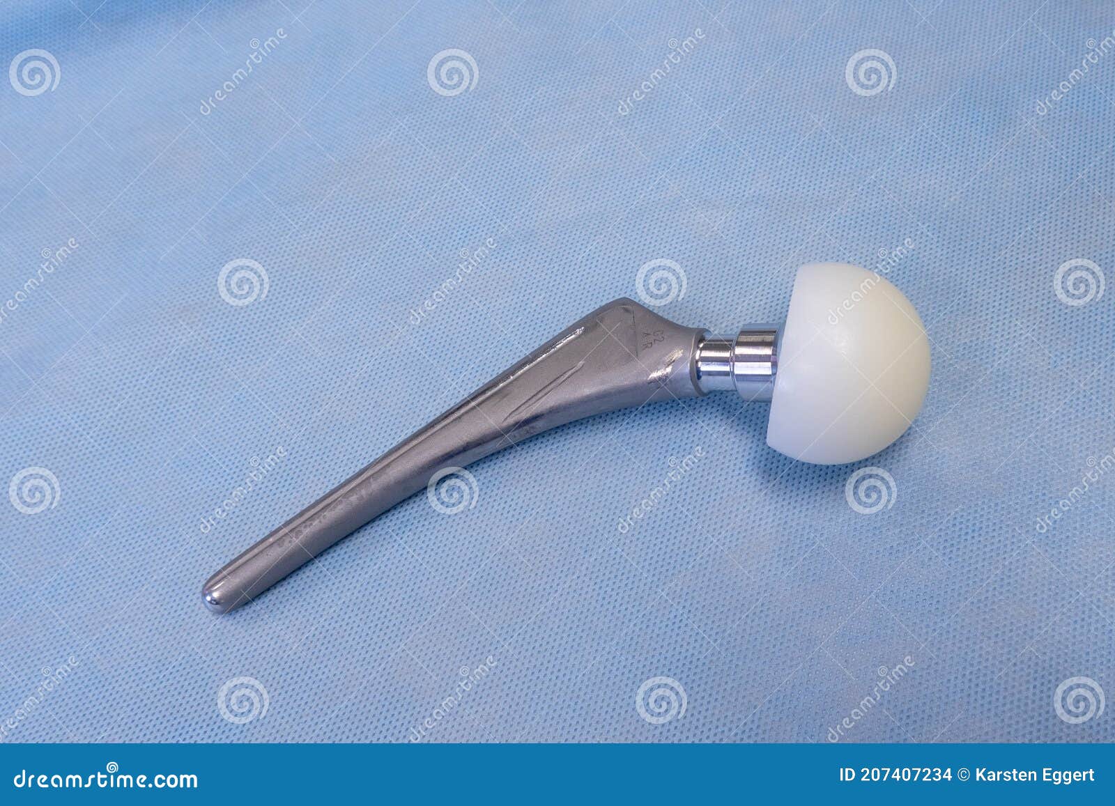 An Explanted Surgical Hip Prosthesis Lies on an Operating Table Stock ...