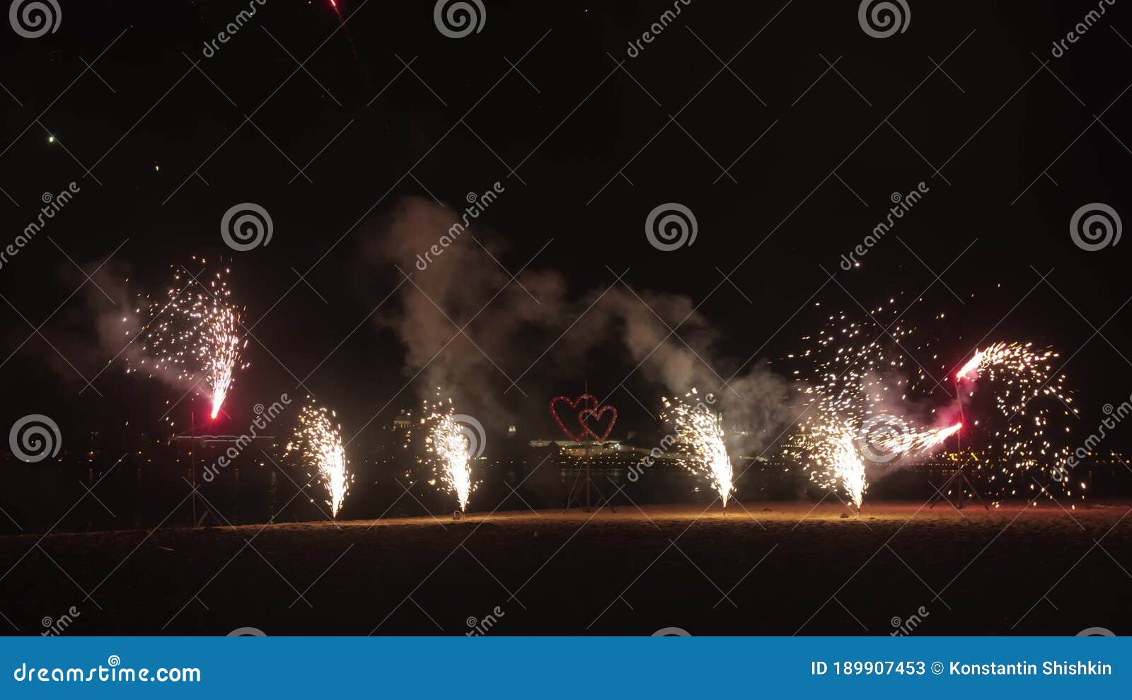 Exploding and Spinning Fireworks on the Beach and Burning Stand in Hearts Shape Stock Video ...