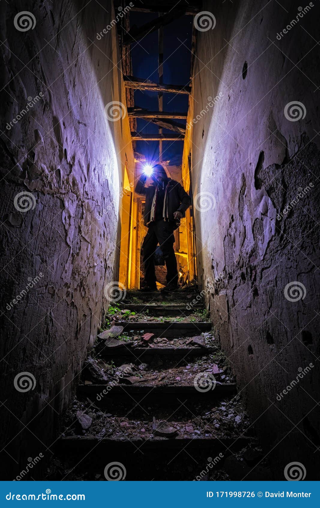 Man Explorer With Flashlight Inside Corridor Or Tunnel Of Ruined ...