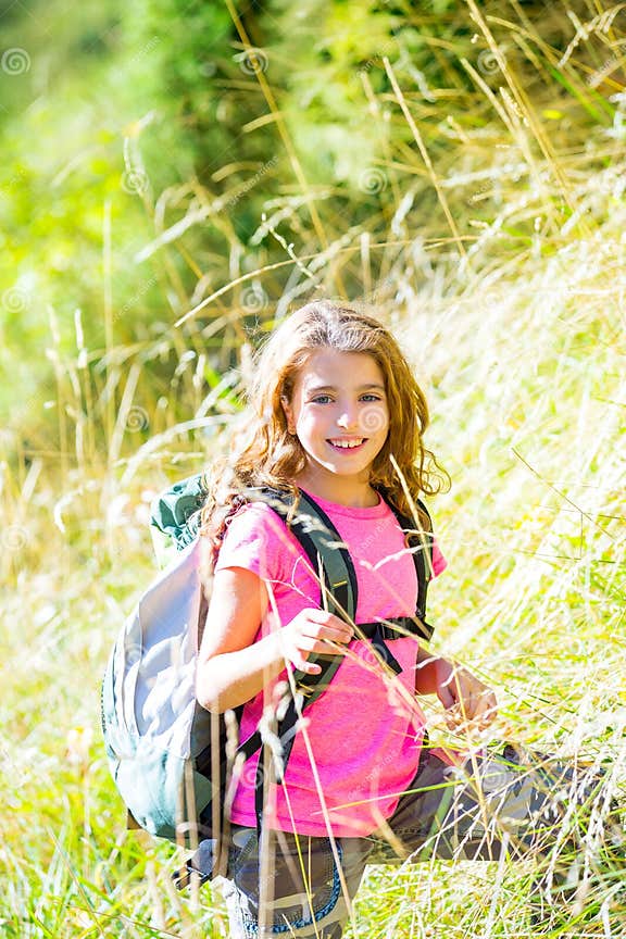 Explorer Kid Girl Walking with Backpack in Grass Stock Image - Image of ...