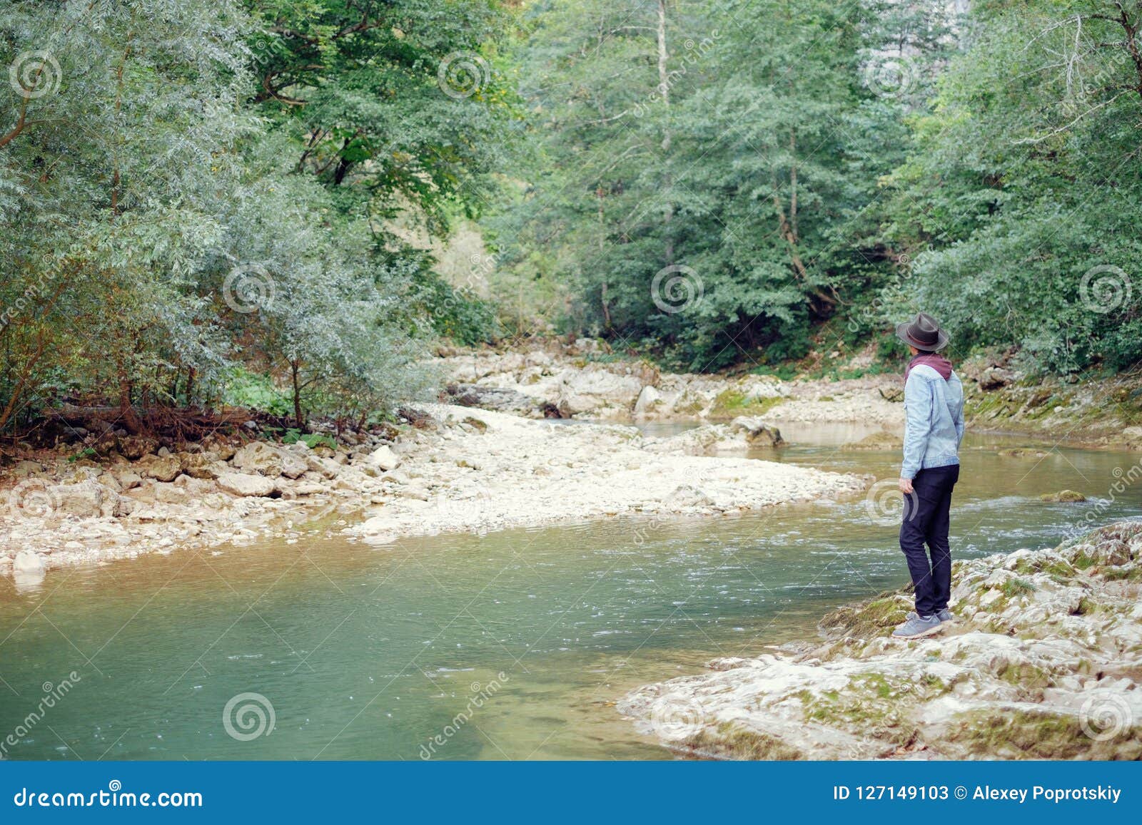 Explorer Man Standing on the River Bank. Stock Image - Image of ...