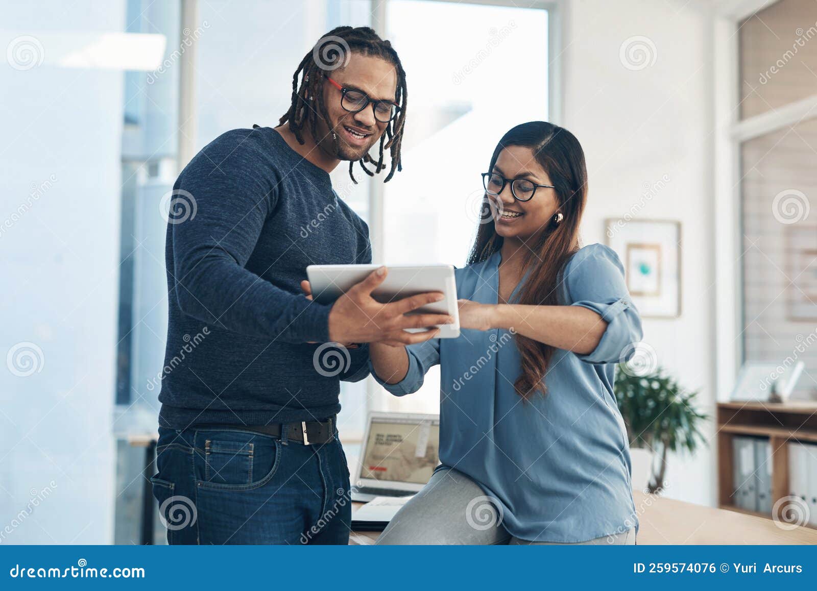 Exploring All Their Options with Ease. Two Businesspeople Using a ...