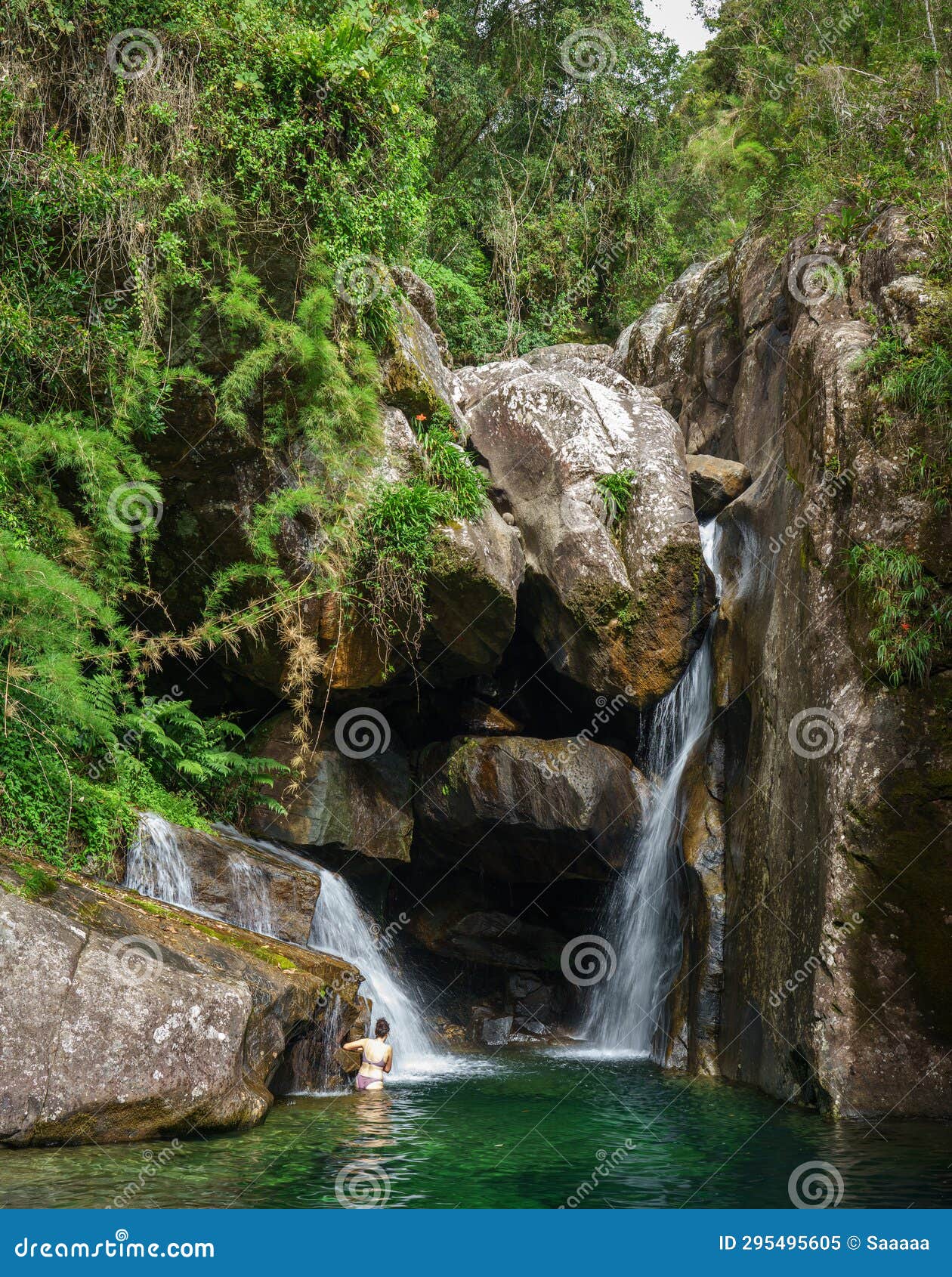Exploring the Hidden Waterfall Cave in the Tropical Rainforest Stock ...