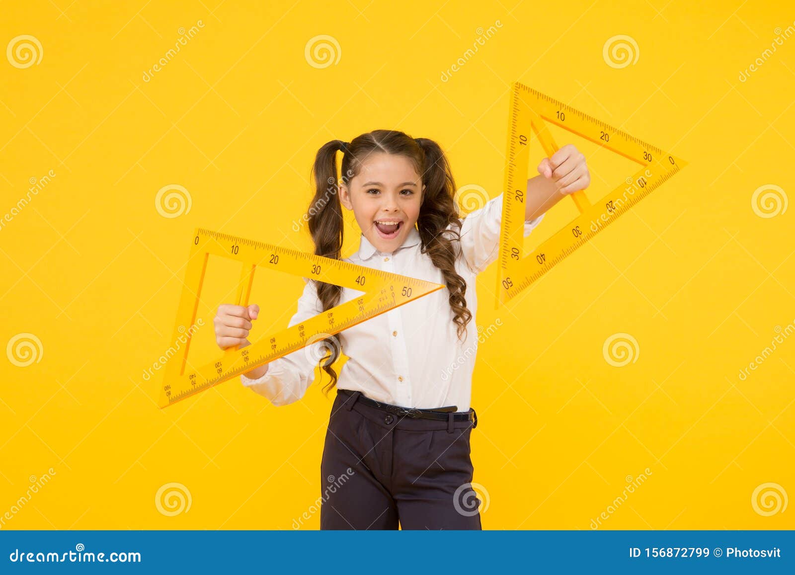 Exploring the Properties of Triangles in the Lesson. Cute Girl Holding ...