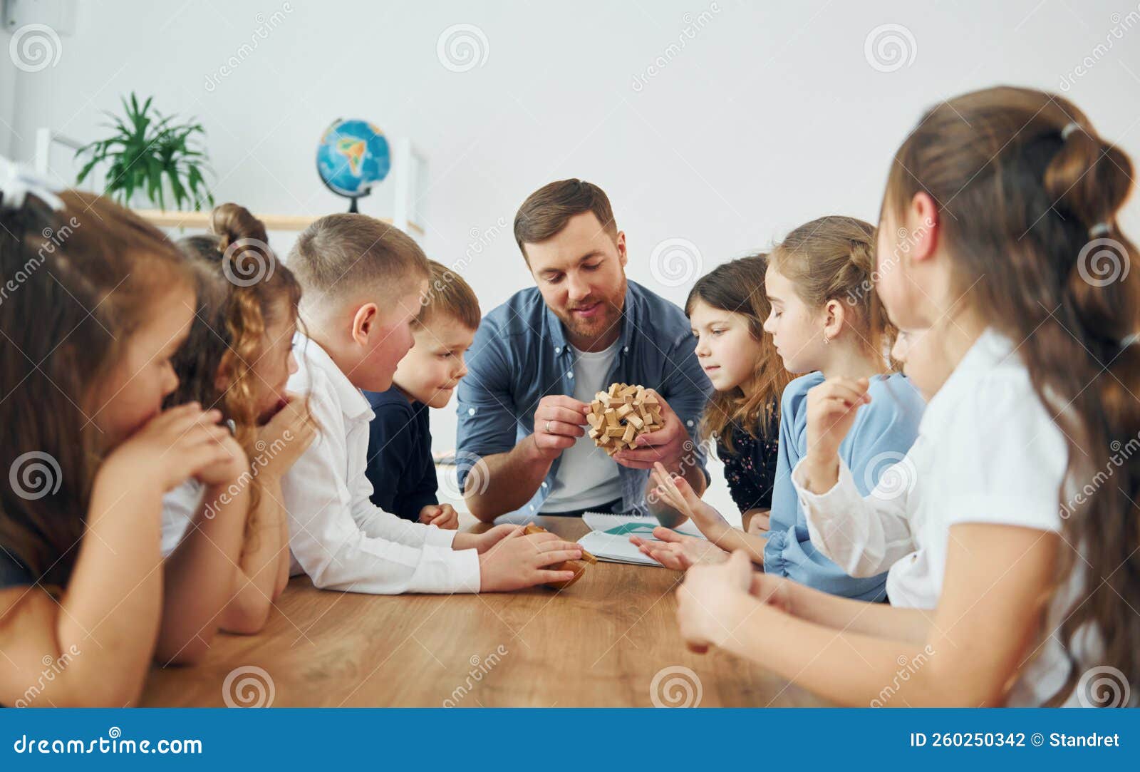 Exploring Puzzle Toy. Group of Children Students in Class at School ...