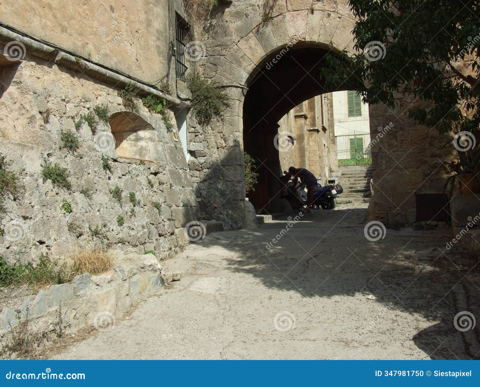 Exploring a Stone Archway in a Village Stock Photo - Image of ...