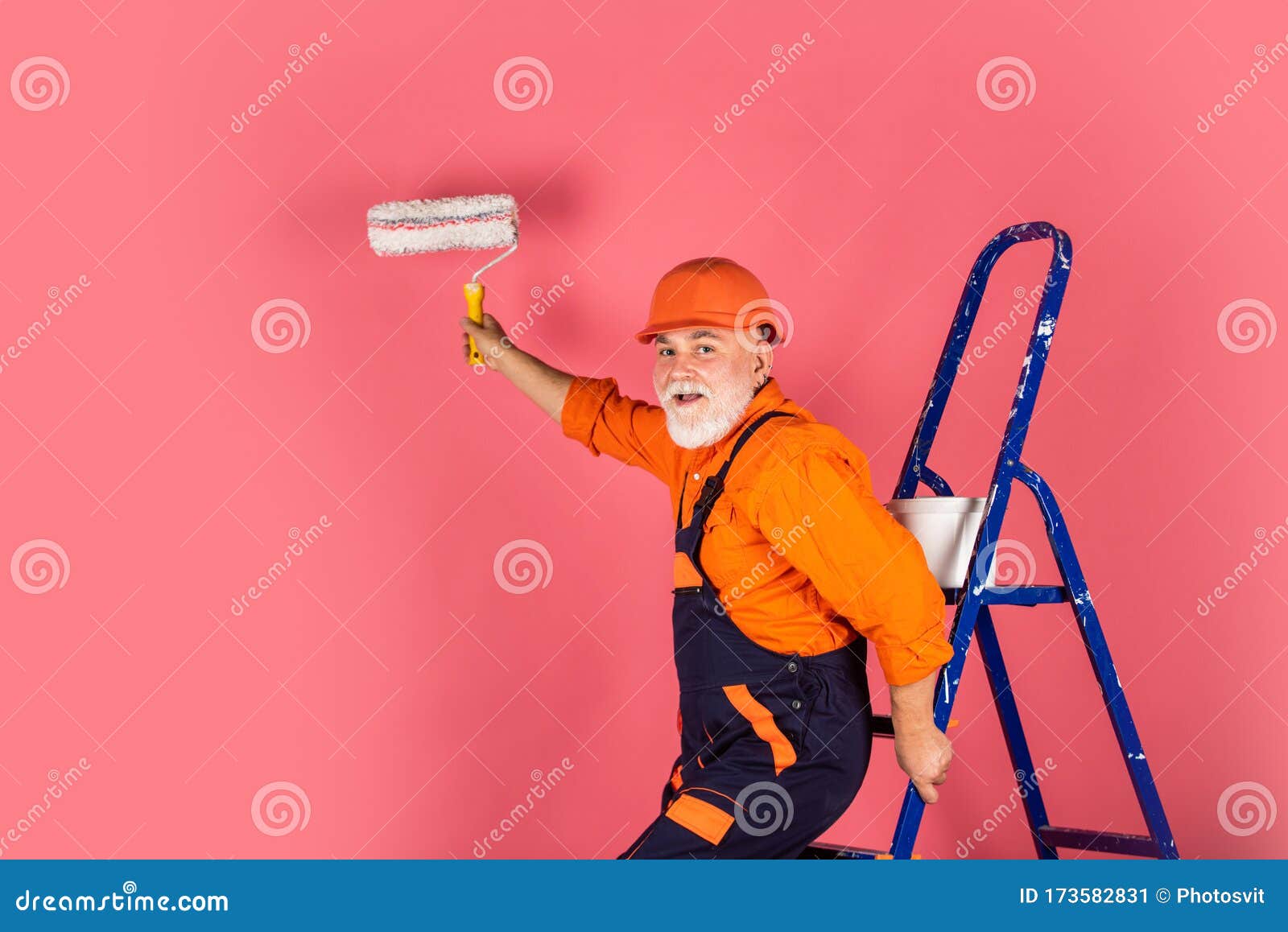 Exploring Tools. Senior Man Painter Use Roller On Ladder. Painting The ...
