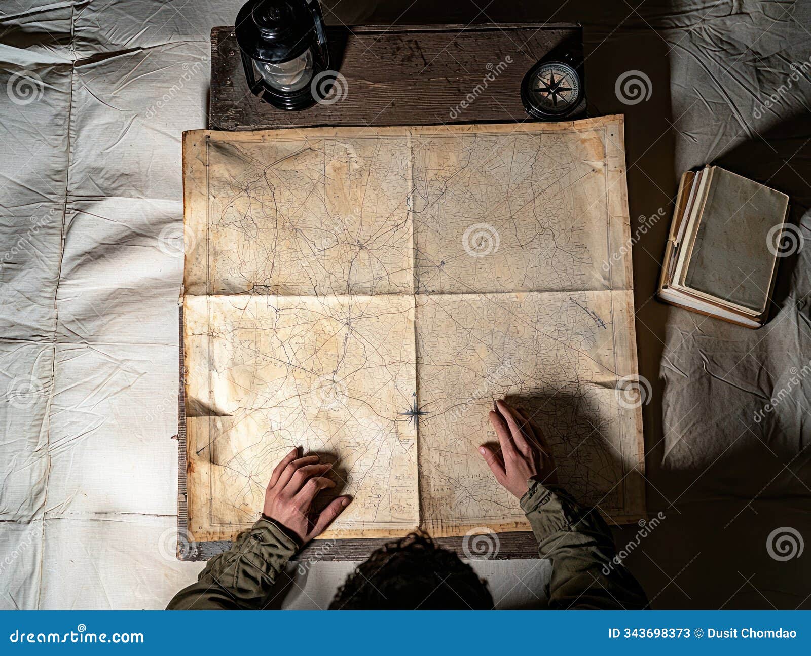 Exploring Vintage Map with Curiosity and Focus, Hands Tracing Routes ...