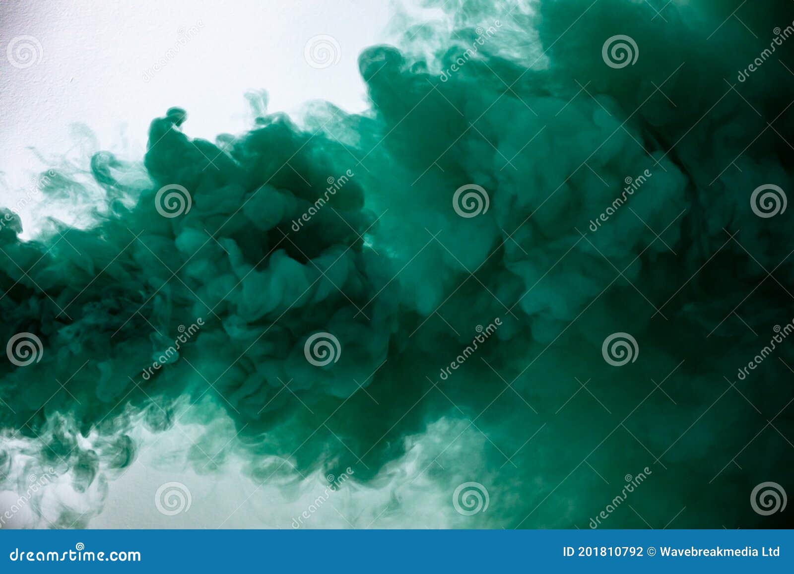 Green Smoke Bomb Exploding Against White Background Stock Photo - Image ...