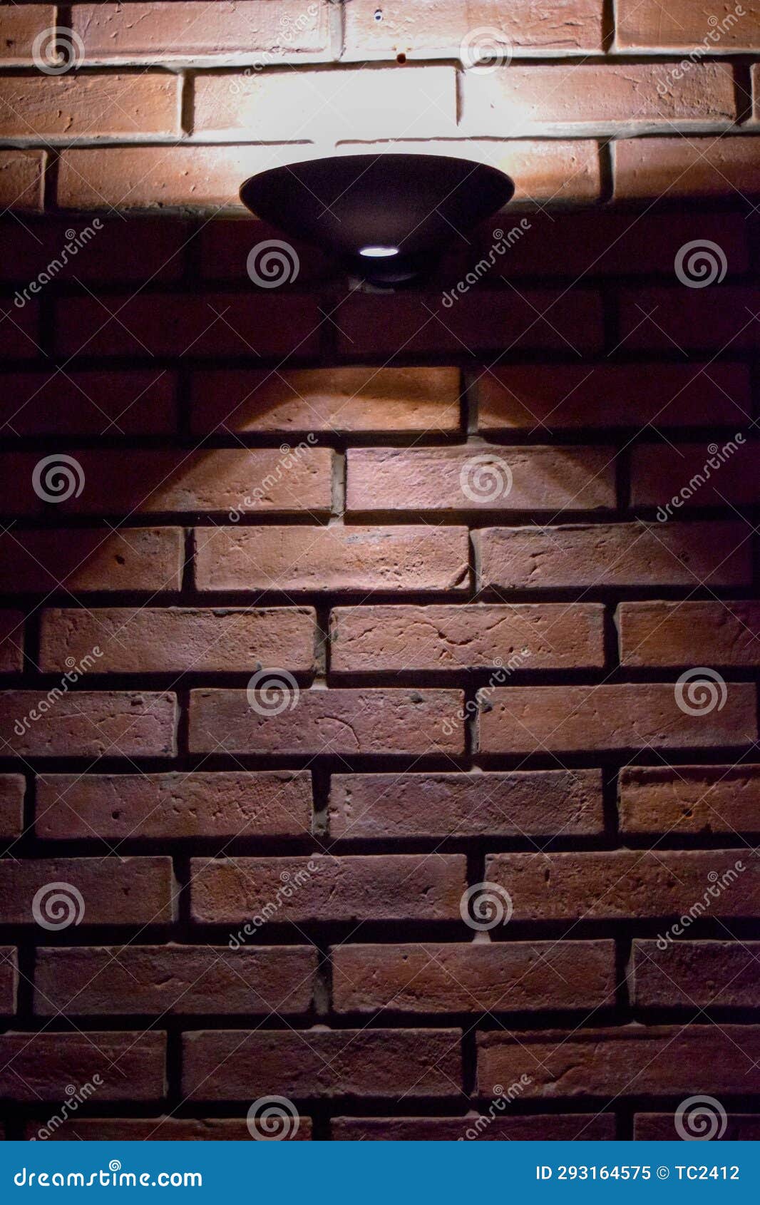 Exposed Brick Wall Illuminated by a Two-way Fixture Stock Image - Image ...