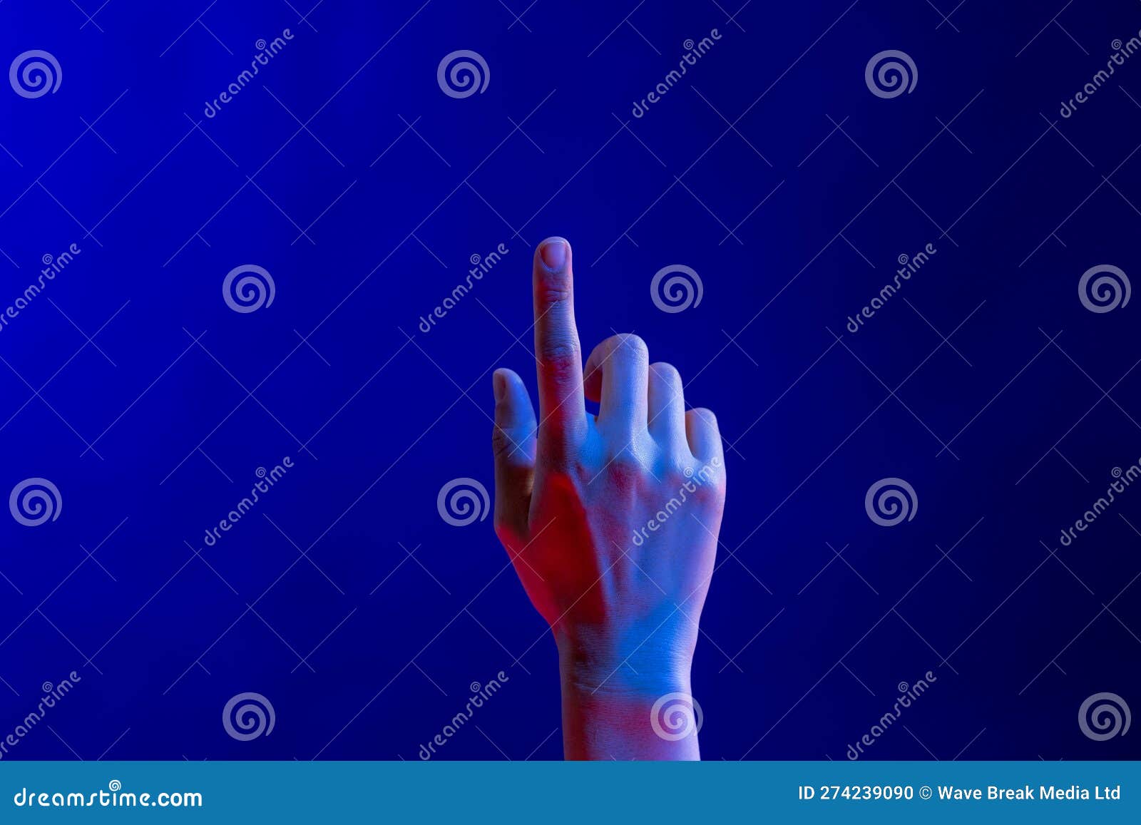 Exposed Hand Pointing Finger in Studio with Blue Light with Copy Space ...