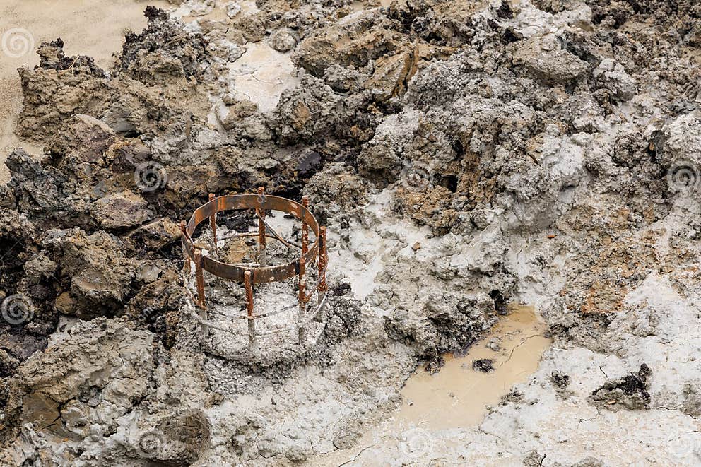 Exposed Metal Framework in Muddy Construction Site Foundations Stock ...