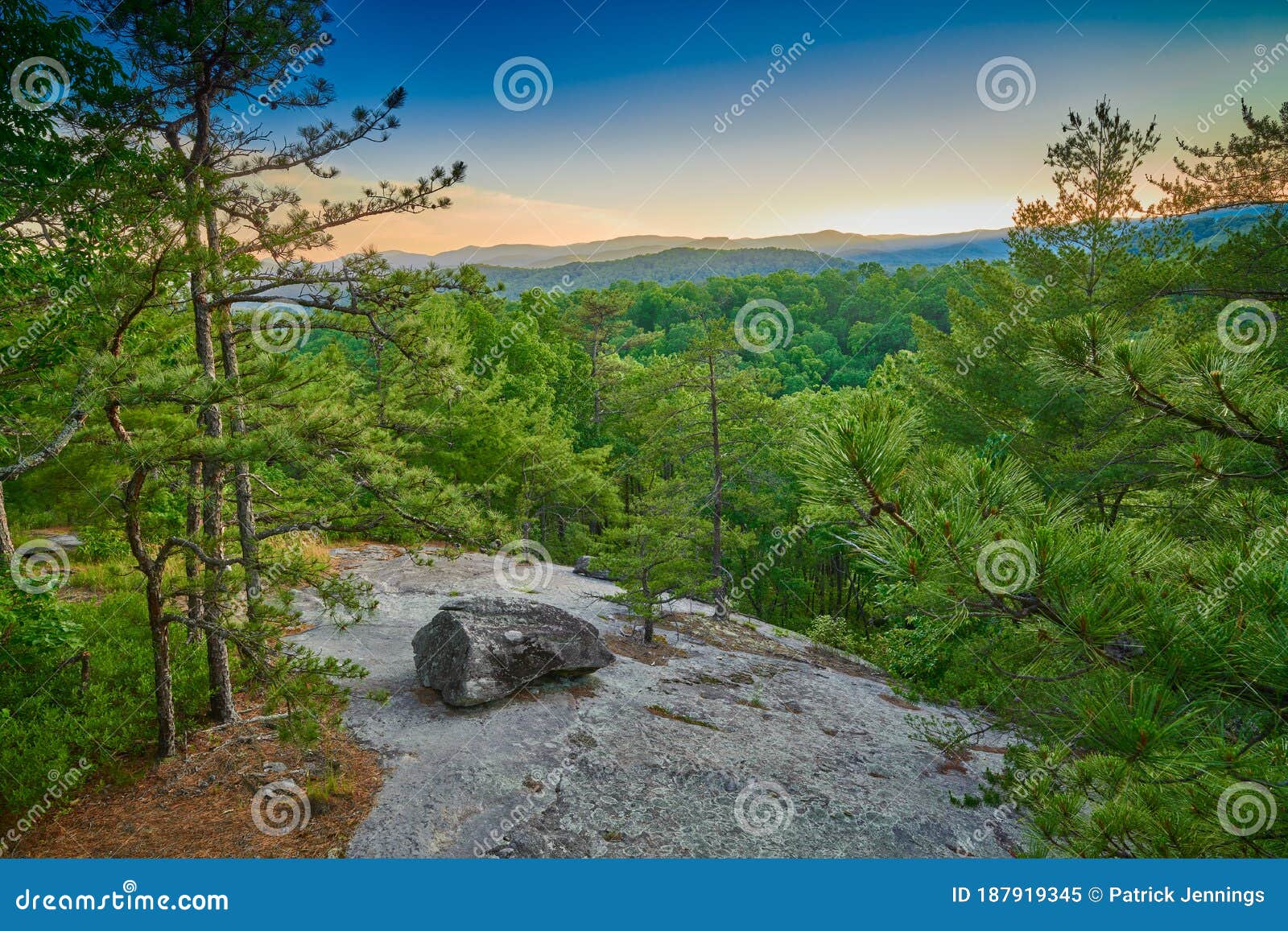 Exposed Rock Face with Large Boulder at Sunset Stock Image - Image of ...