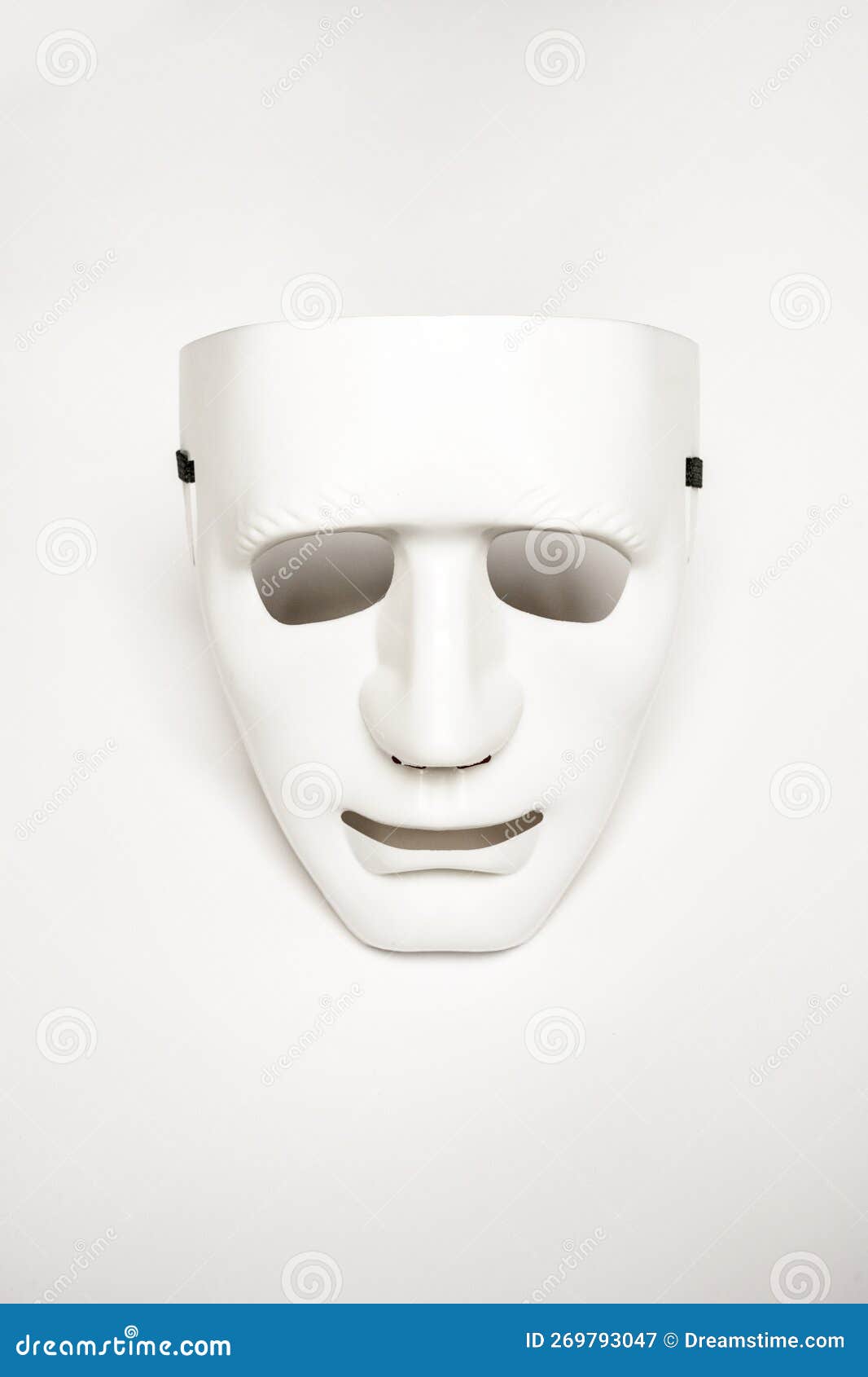 An Expressionless Mask of White Color on a Smooth White Surface Stock ...