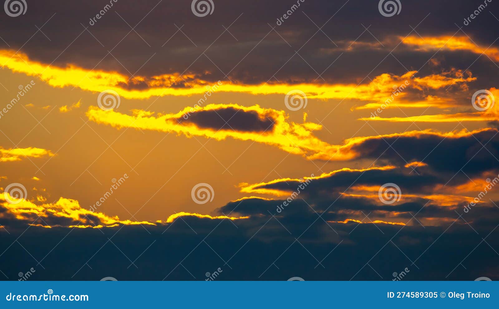 The Expressive Contrast of the Clouds in the Sky. Sunset with Bright ...