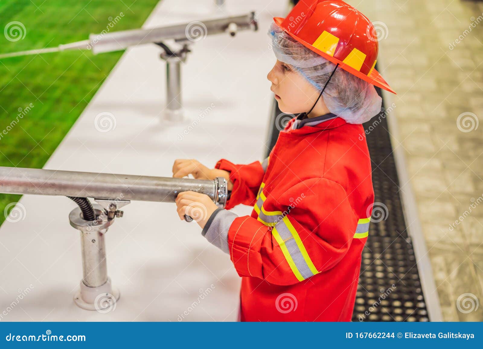 Expressive Cute Toddler with Fireman Outfit Playing Fireman Stock Photo ...