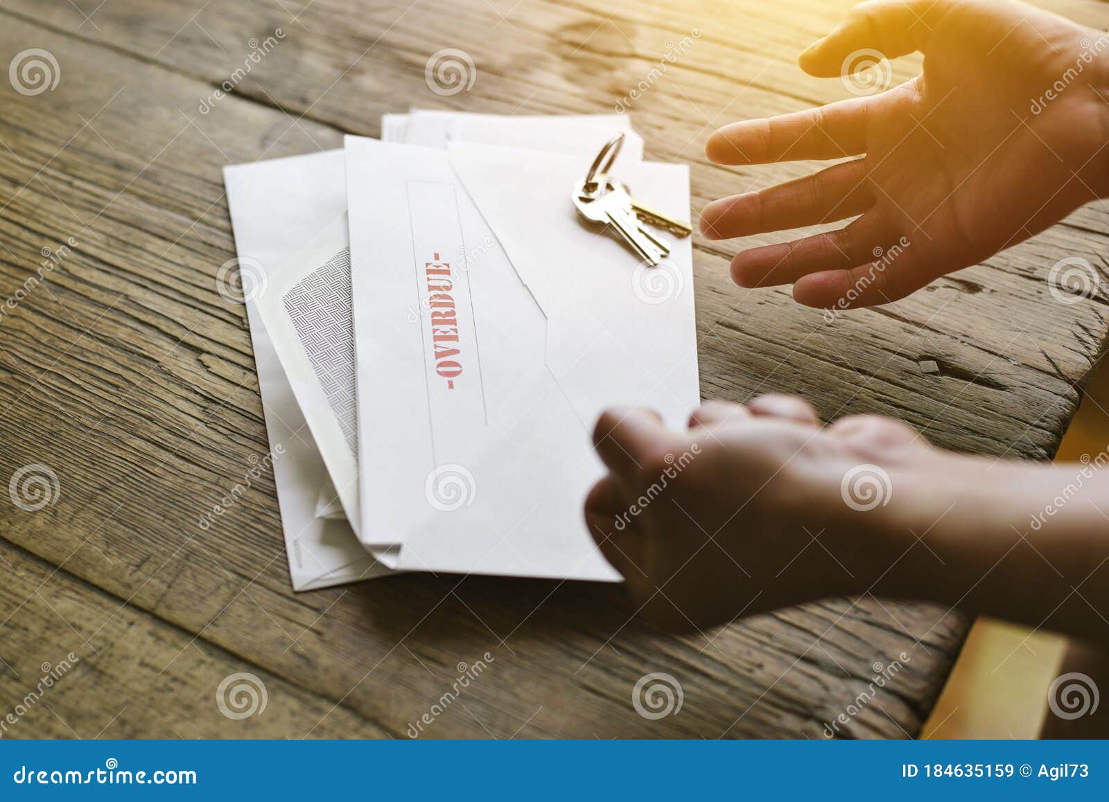 View Of Angry Hands With An Overdue Notice And Keys - Expressive ...
