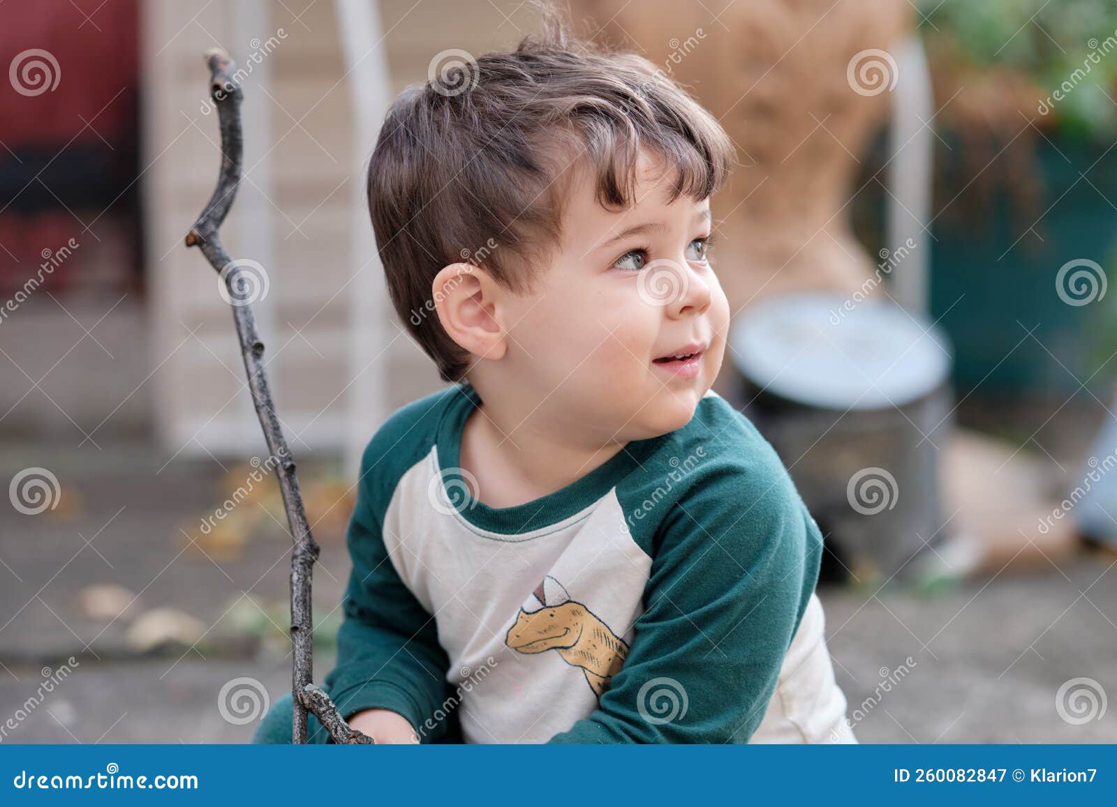 Expressive Little Boy Playing in the Backyard and Making Faces Stock ...