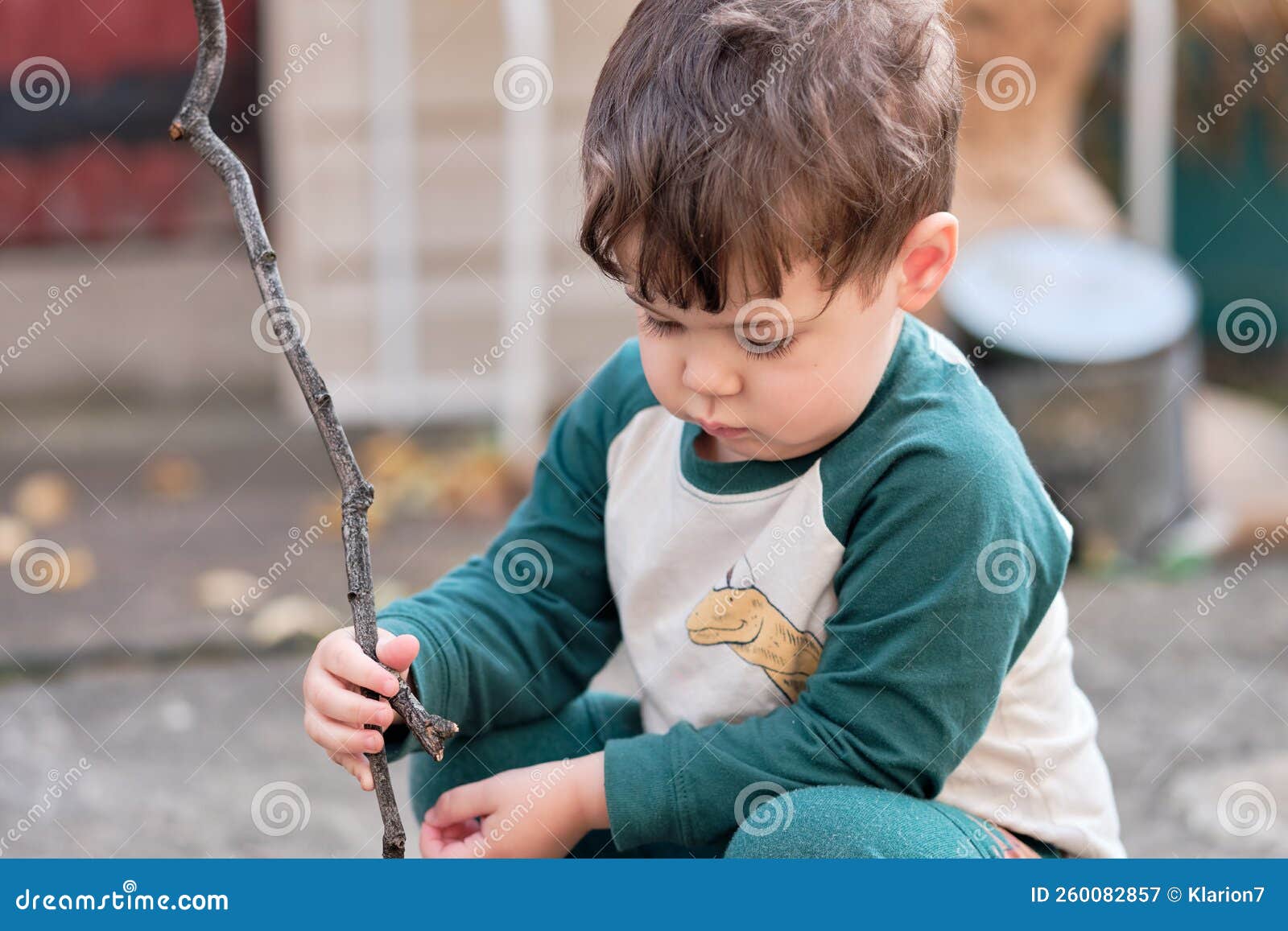 Expressive Little Boy Playing in the Backyard and Making Faces Stock ...
