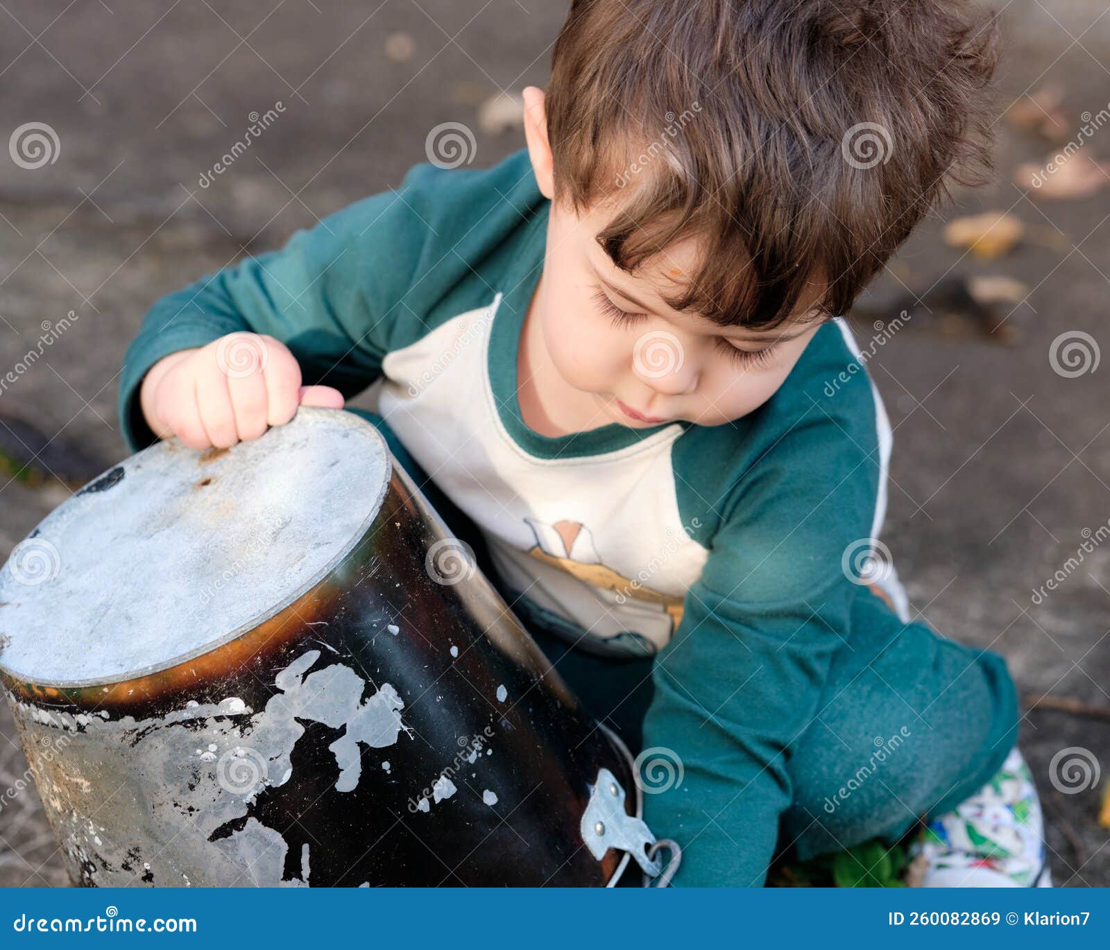 Expressive Little Boy Playing in the Backyard and Making Faces Stock ...