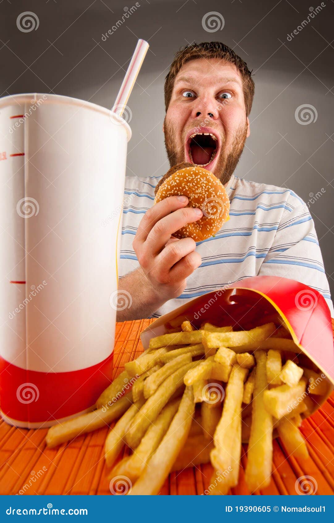 Expressive Man Eating Fast Food Stock Image - Image of hungry, eating ...