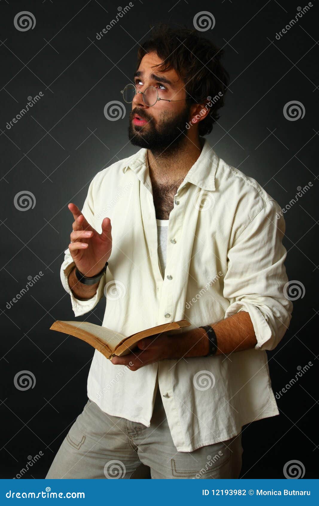 Expressive Man Gesturing with Book Stock Photo - Image of isolated ...