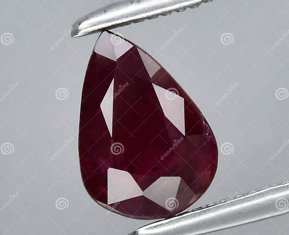 Exquisite Deep Red Pear-Shaped Ruby Gemstone Captured in Reflective ...
