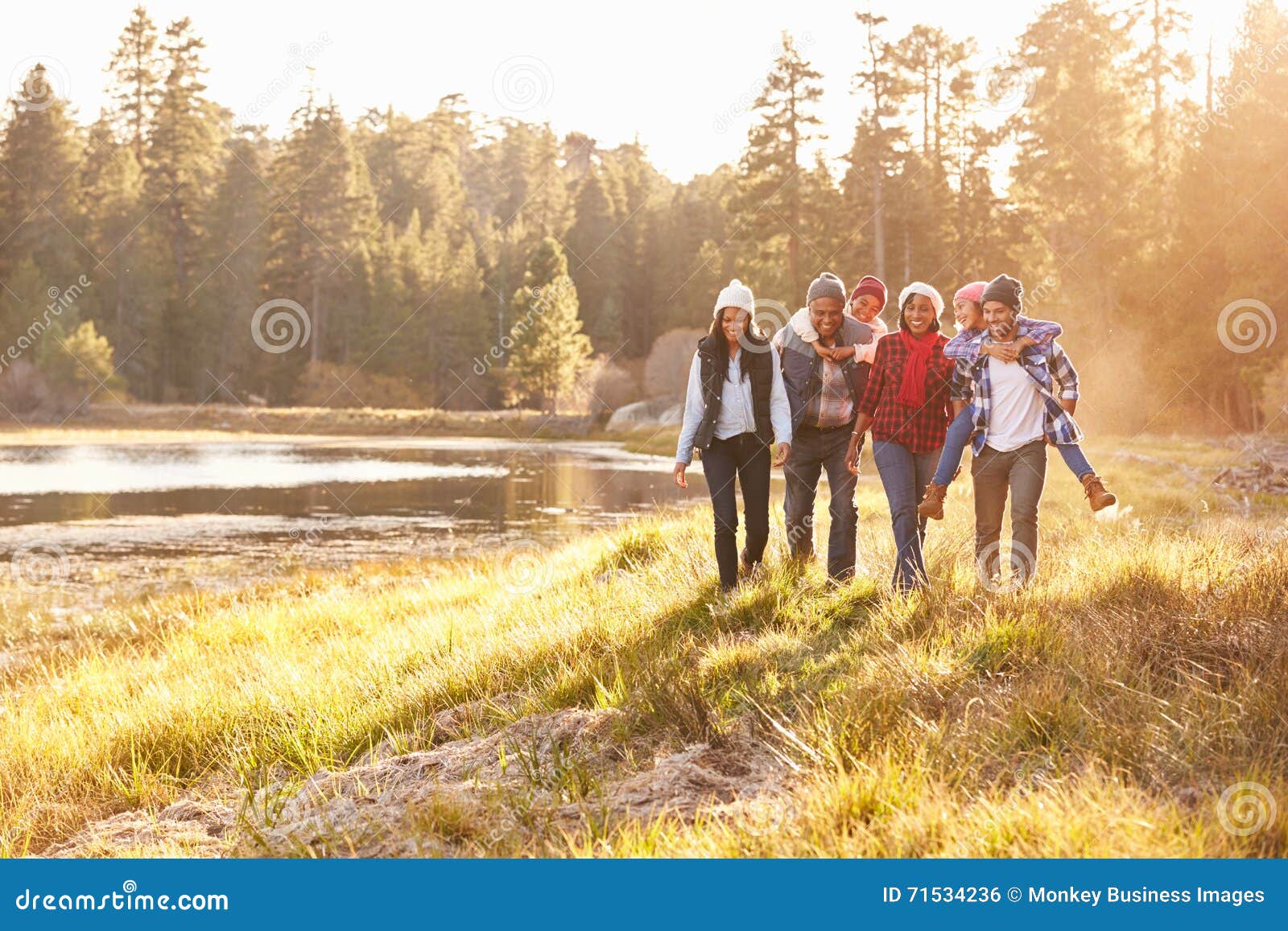 Extended Family Group Walking by Lake Stock Photo - Image of hike ...