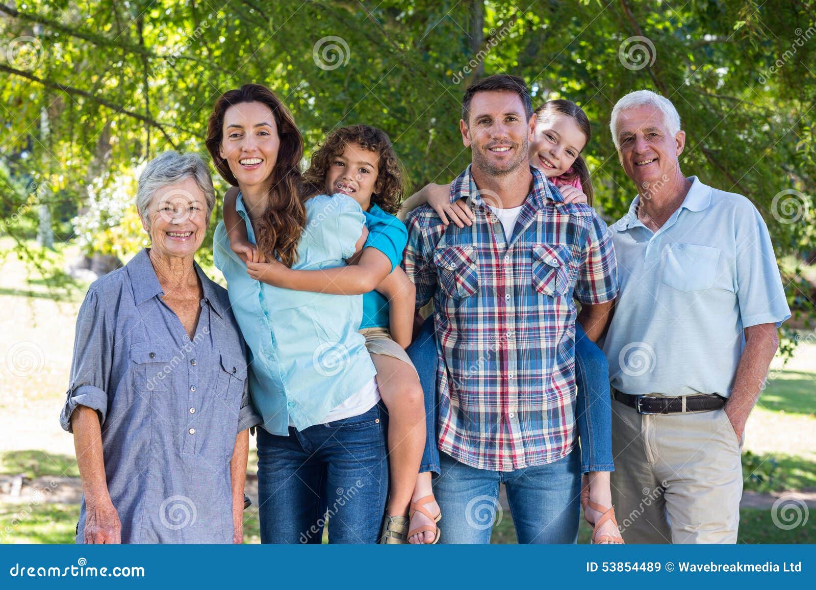 Extended Family Smiling in the Park Stock Image - Image of children ...