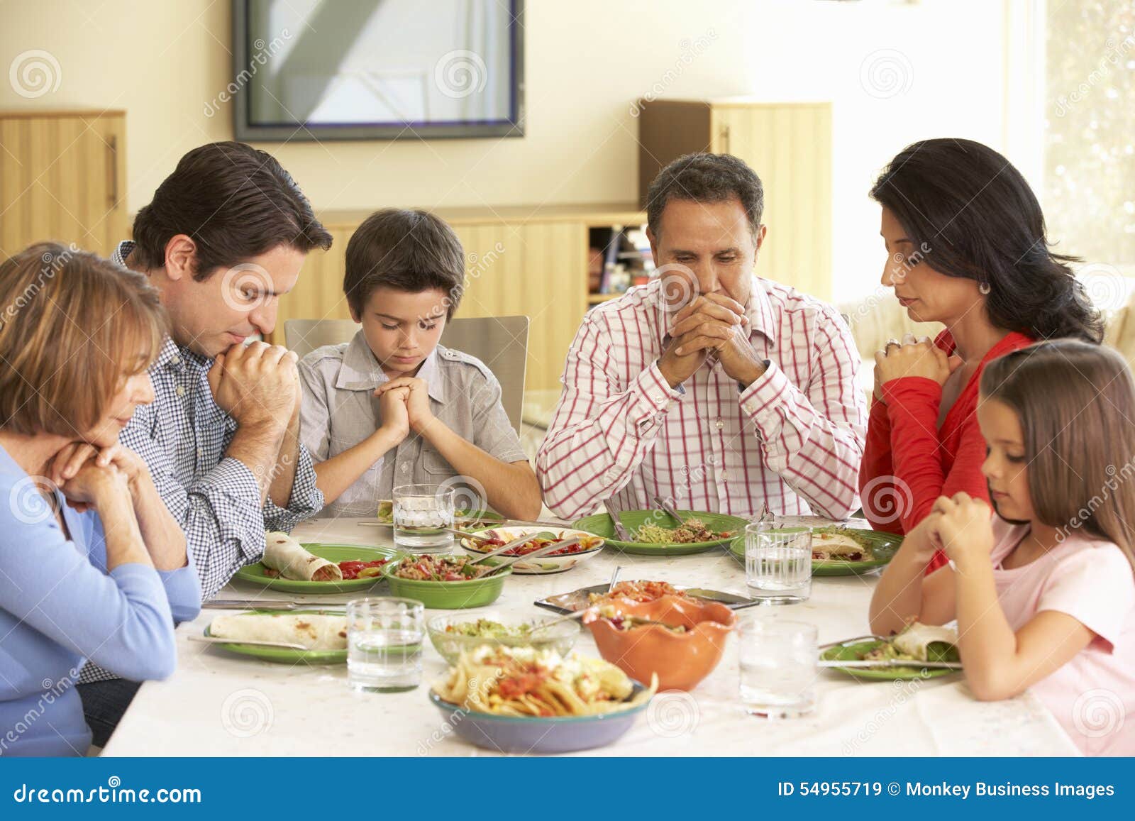 Hispanic Family Praying Together
