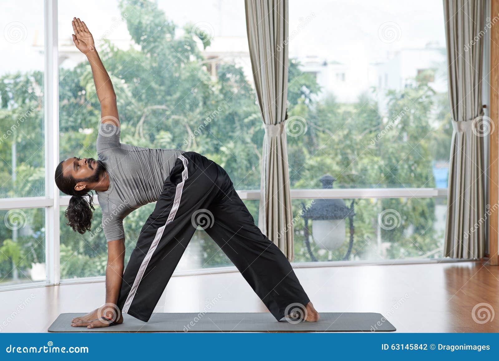 Extended triangle pose stock photo. Image of copyspace - 63145842