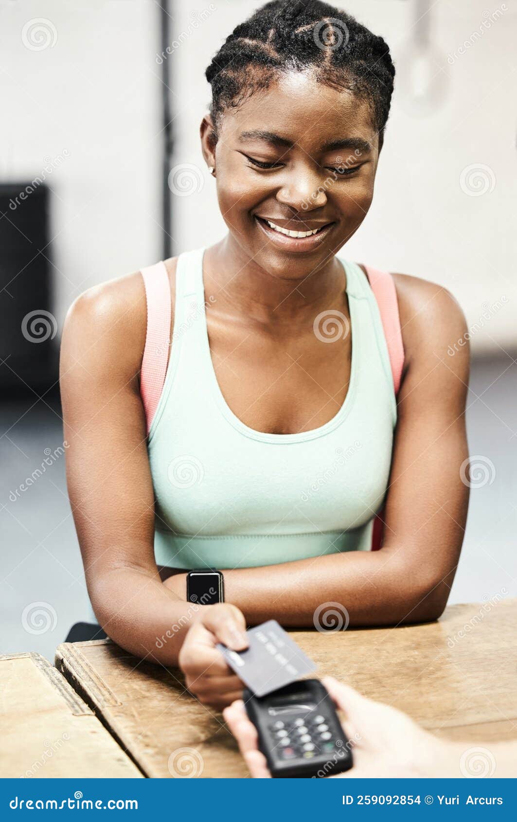 Extending My Gym Membership An Attractive Young Woman Using Her Credit Card To Pay For Her Gym