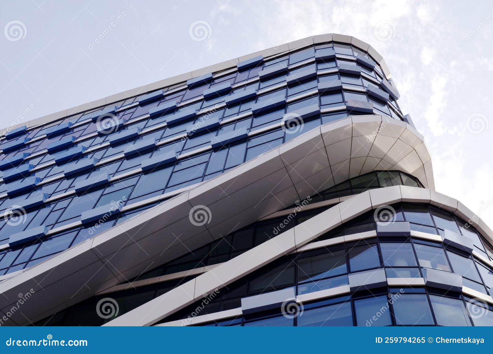 Exterior of Beautiful Modern Skyscraper Against Blue Sky, Low Angle ...