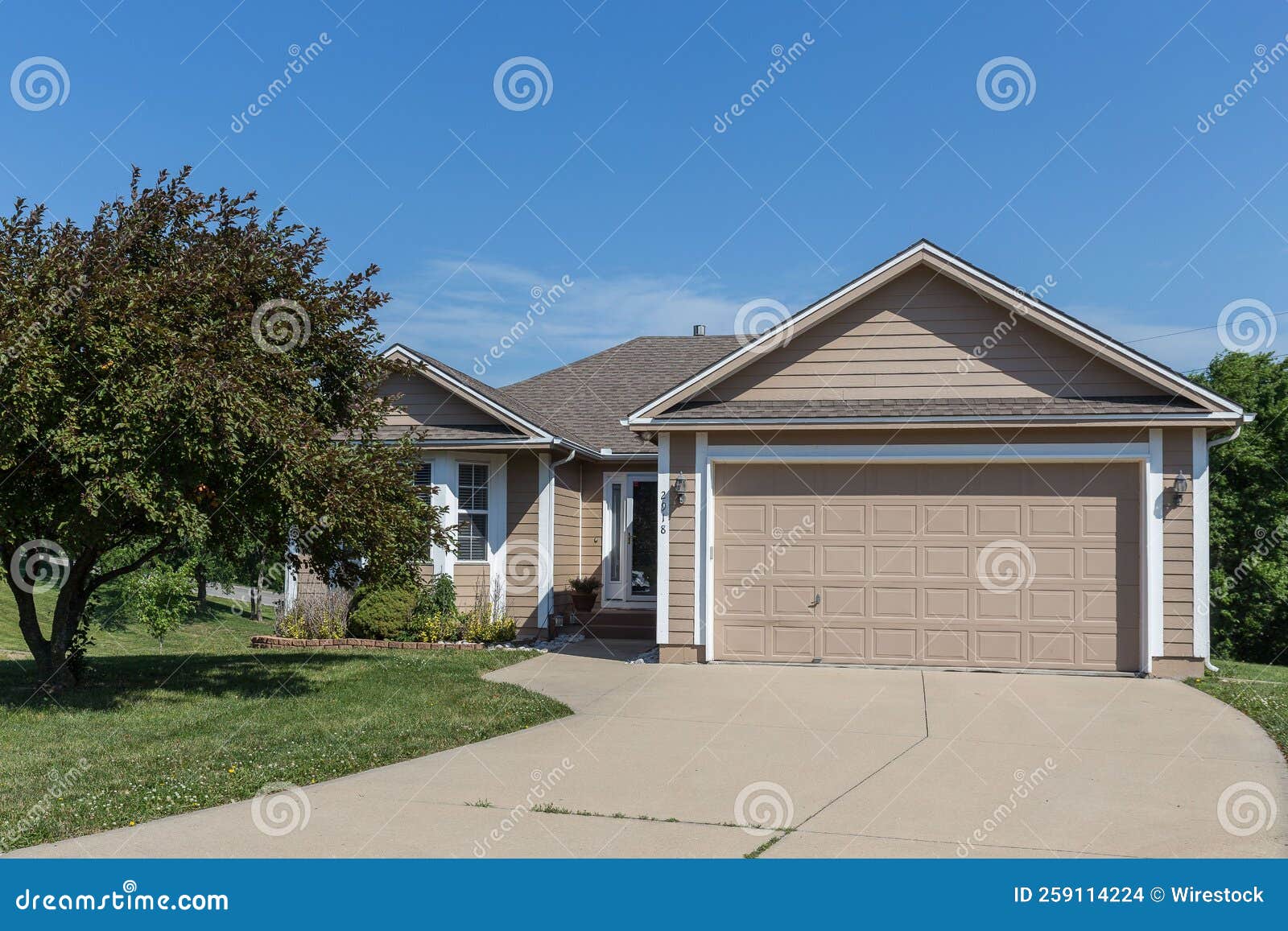Exterior of a Big House with a Garage and Its Backyard Under the Clear ...
