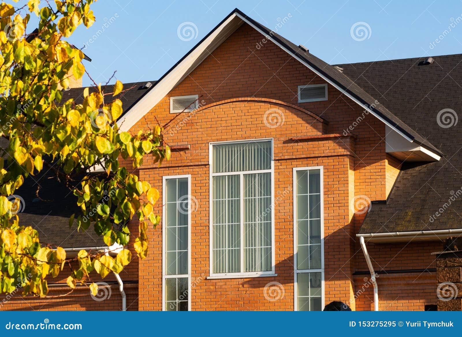 Exterior of Brick House with Three Rectangular Windows and Multilevel ...