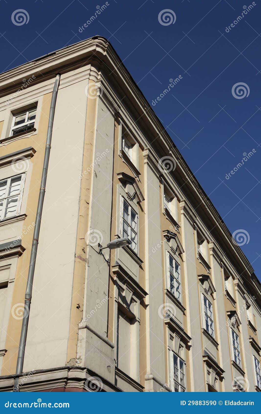 The Corner Of The Building With Arches And A Tiled Roof. Stock Image ...