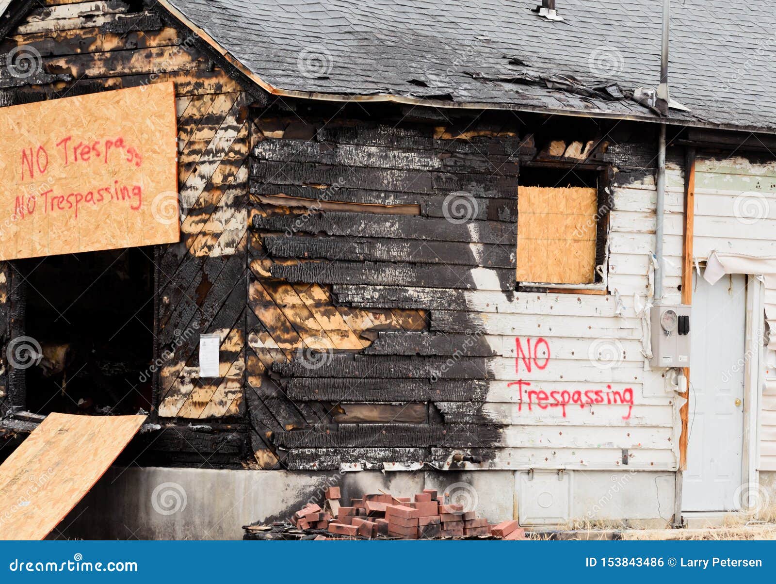 Aftermath of a house fire stock photo. Image of shingles - 153843486