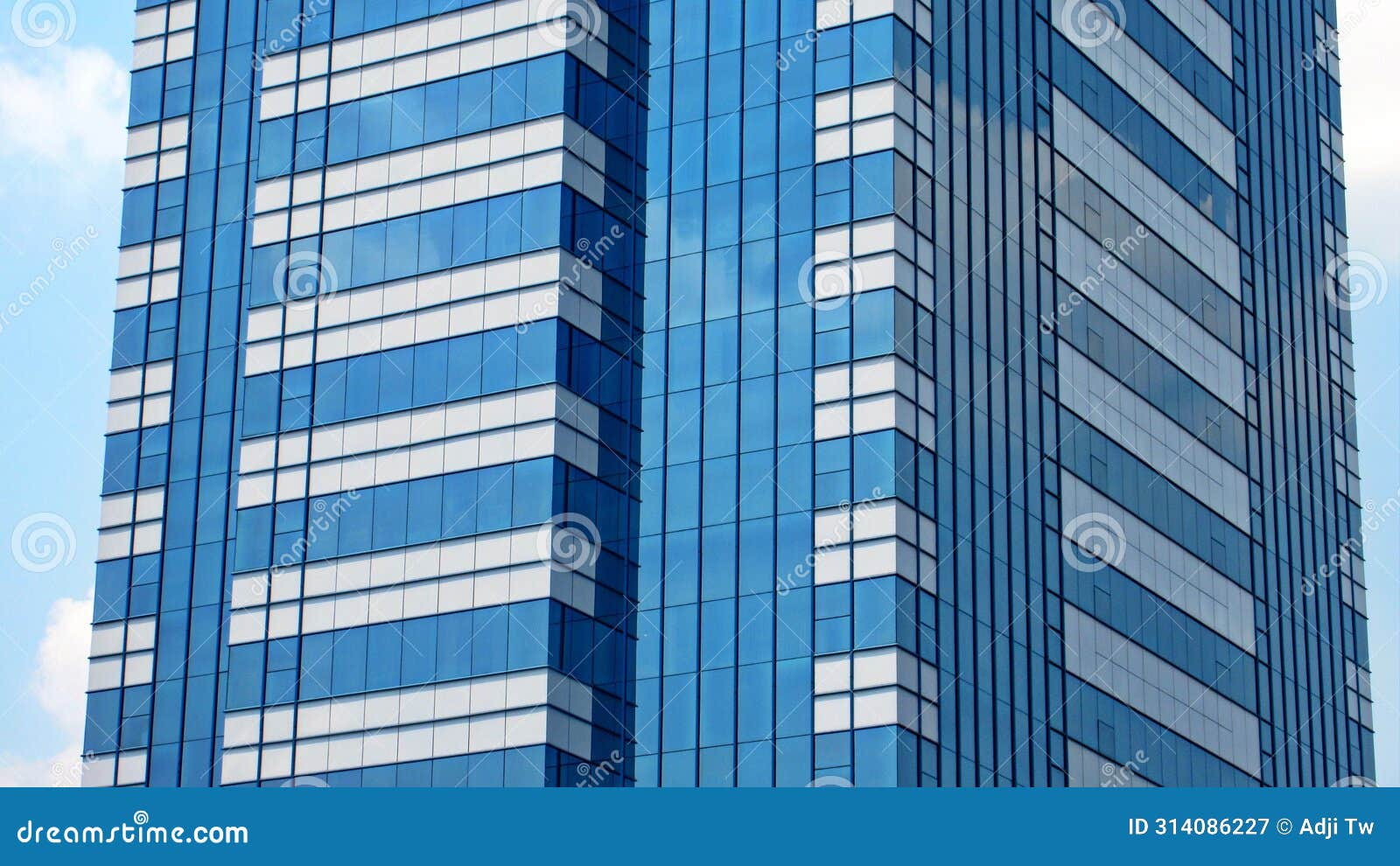 Exterior of a Modern Building with Sky Blue and White Glass Windows ...
