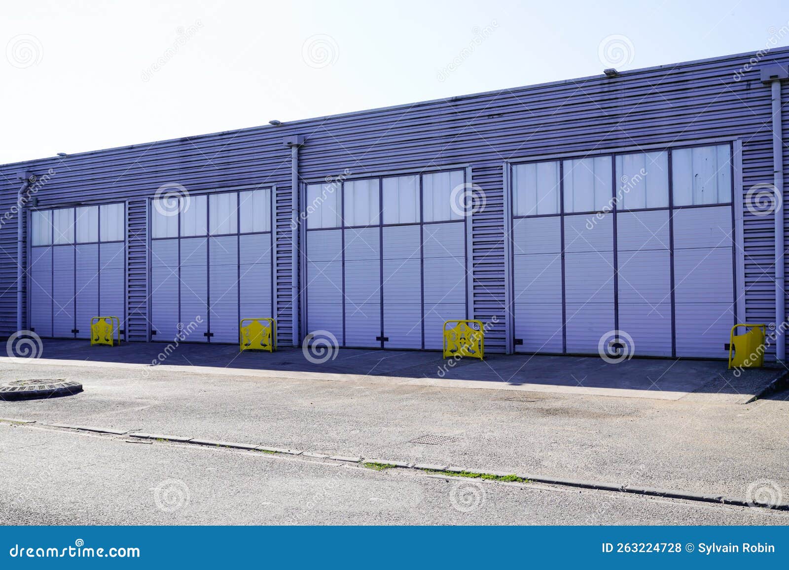 Exterior of Modern Distribution Center Warehouse Grey Door Facade Stock ...