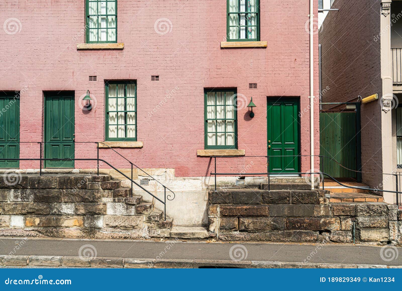 Exterior of Old Red Brick Townhouse with Green Doors Stock Image ...