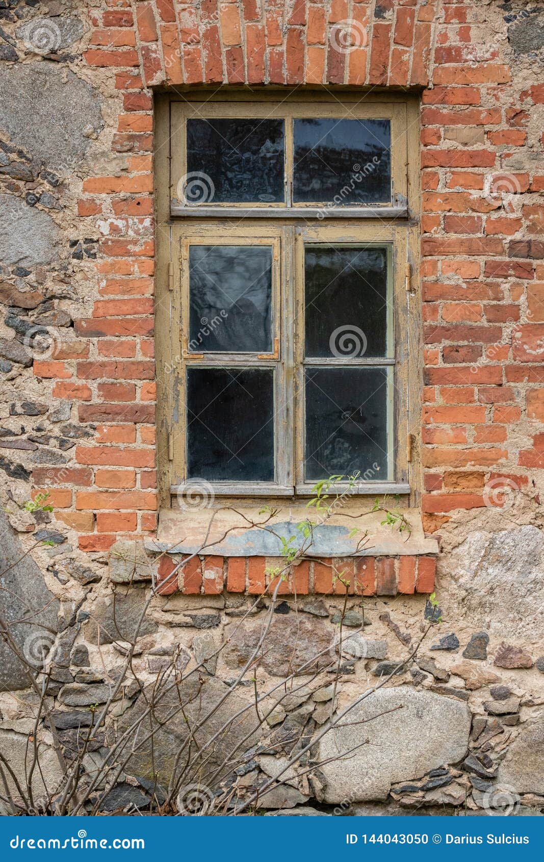 Exterior Of An Old Stone And Brick House With Vintage Window Frame ...