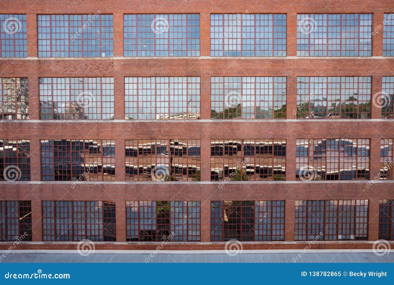 A Massive Outside Wall of a Warehouse with Countless Windows. Stock ...